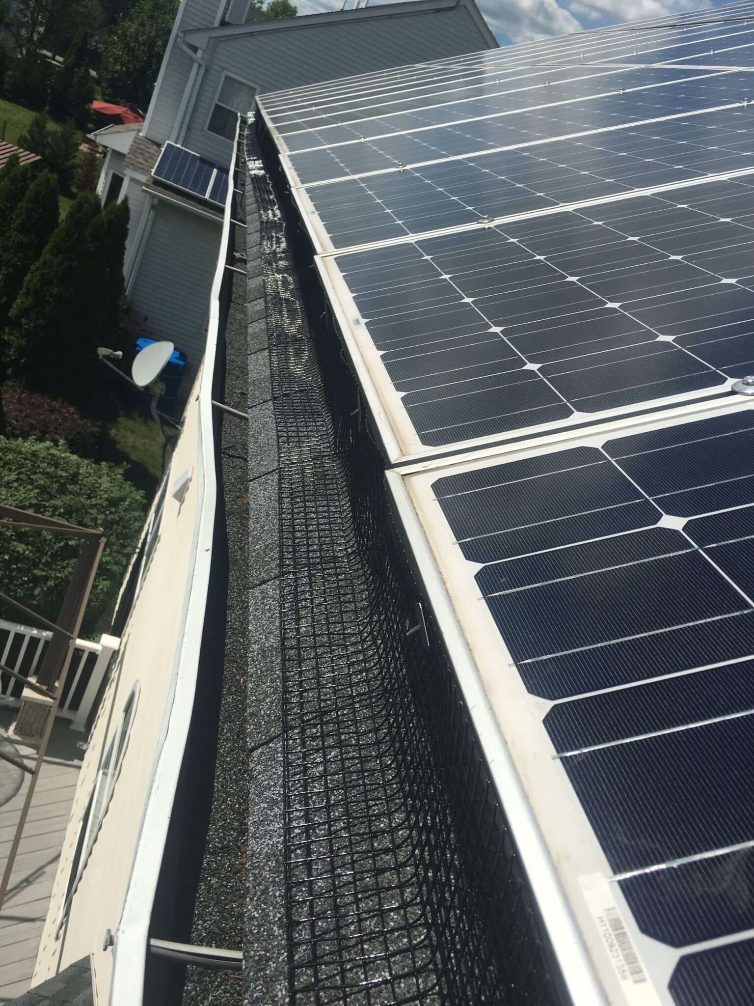 Professional installation of a critter guard.